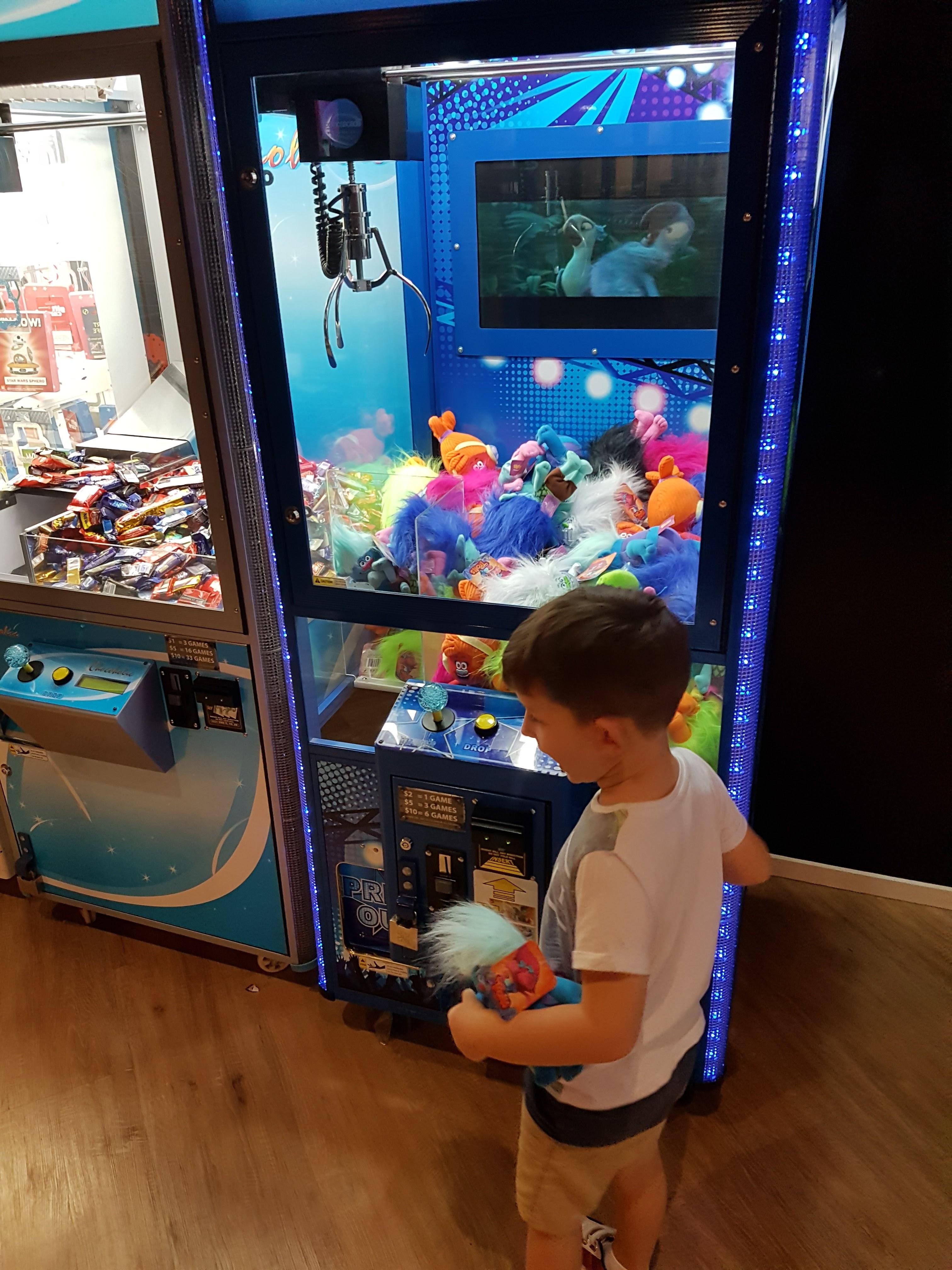 Win a prize from the claw arcade game